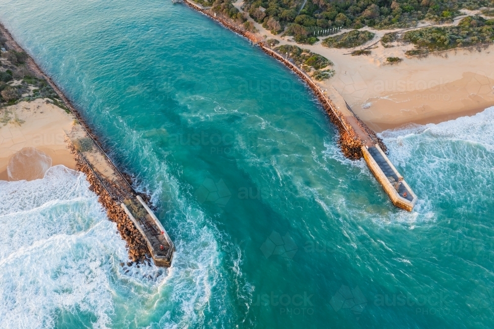 Image of Aerial view of strong current pushing the sea between coastal ...