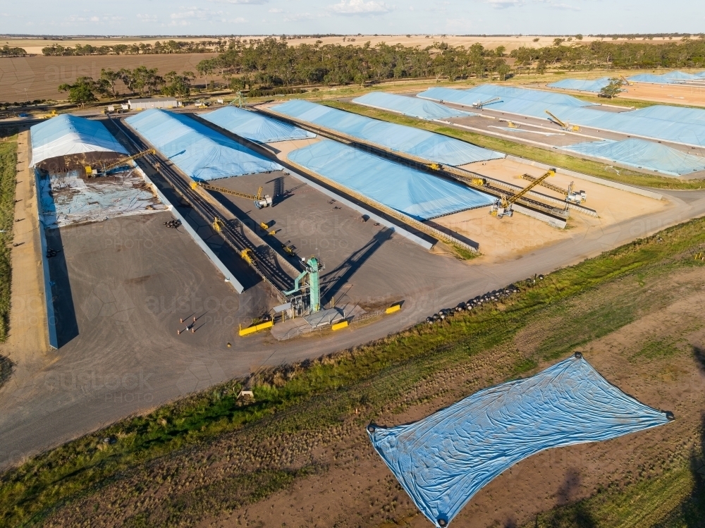 Image of Aerial view of tarpaulins covering grain storage pits in a ...