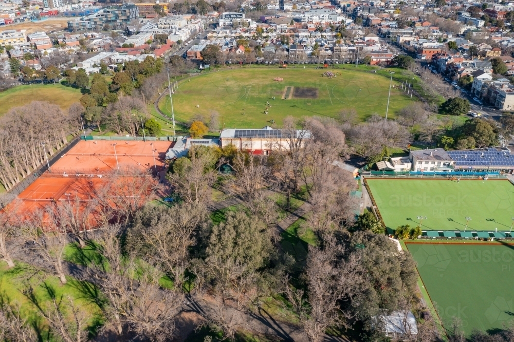 Image of Aerial view of tennis courts and sports ovals in a city park ...