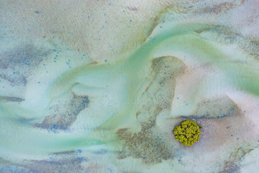 Image of Aerial view of tidal patterns and sand bars in a coastal ...