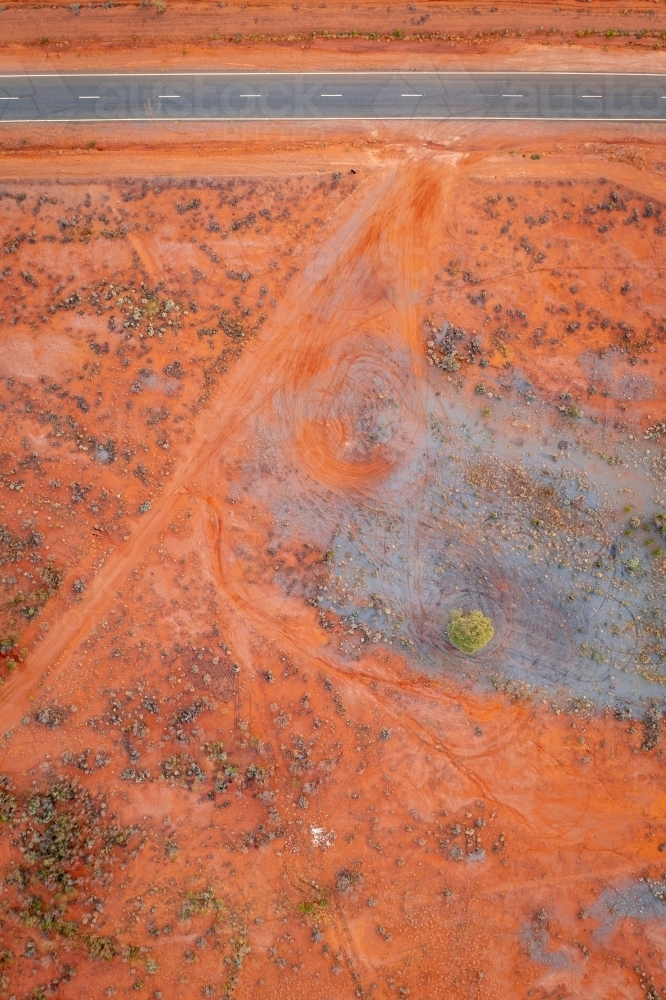 Image of Aerial view of tracks branching of an outback highway through ...