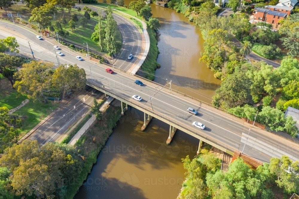 Image of Aerial view of traffic crossing on and under bridge over an ...