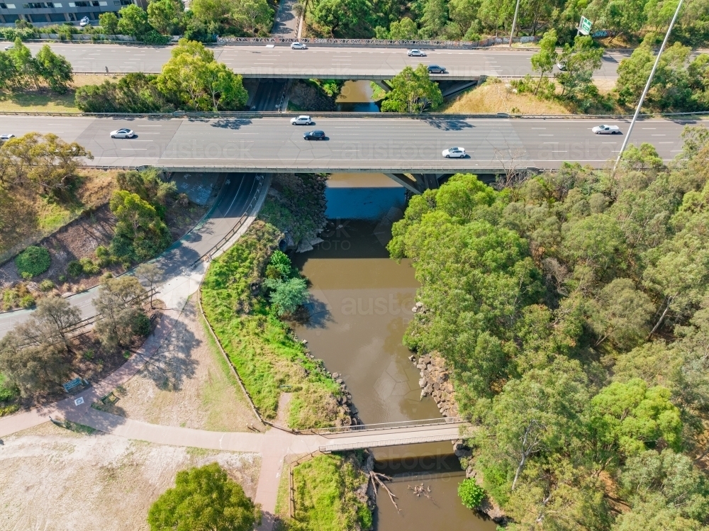 Image of Aerial view of traffic on a multi-lane freeway bridge over a ...