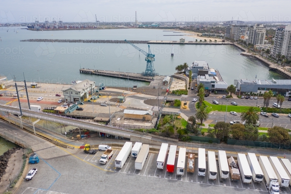 Image of Aerial view of trucks lined up in parking bays at a ferry ...
