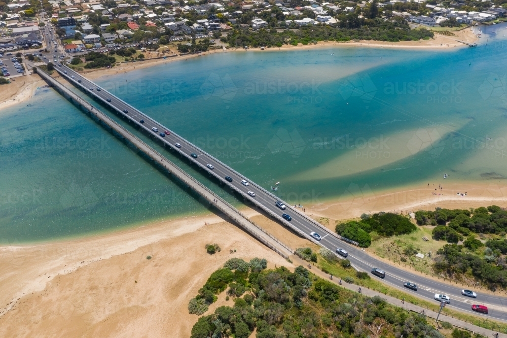 Image of Aerial view of two bridges crossing a wide blue river ...