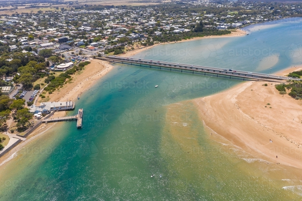 Image of Aerial view of two bridges crossing a wide blue river ...