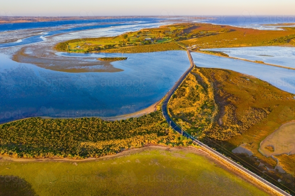 Image of Aerial view of two coastal islands connected by a narrow road ...