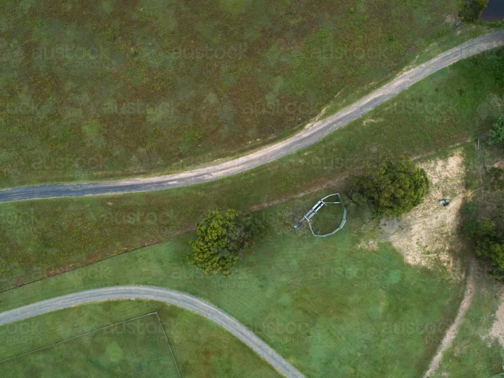 Image of aerial view of two driveways in rural paddock with stockyard ...
