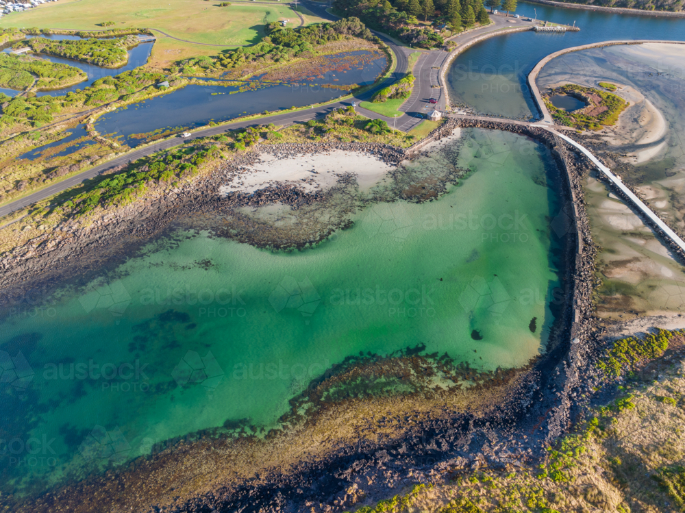Image of Aerial view of walking paths around a coastal backwash and ...