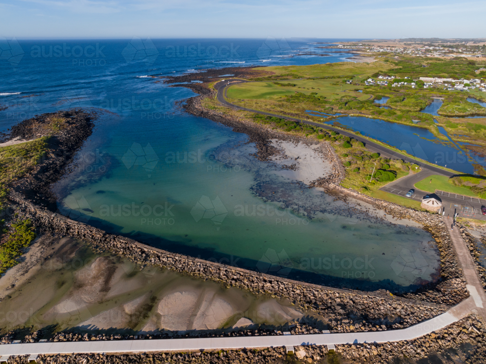 Image of Aerial view of walking paths around a coastal inlet and ...