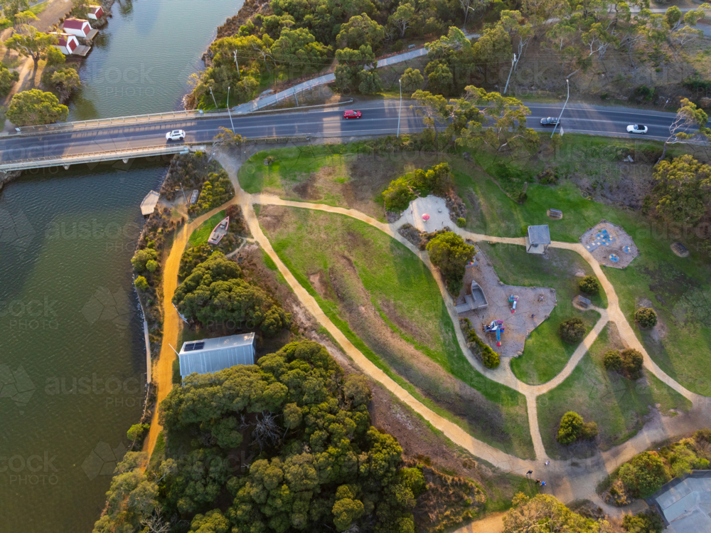 Image of Aerial view of walking tracks around a river side playground ...