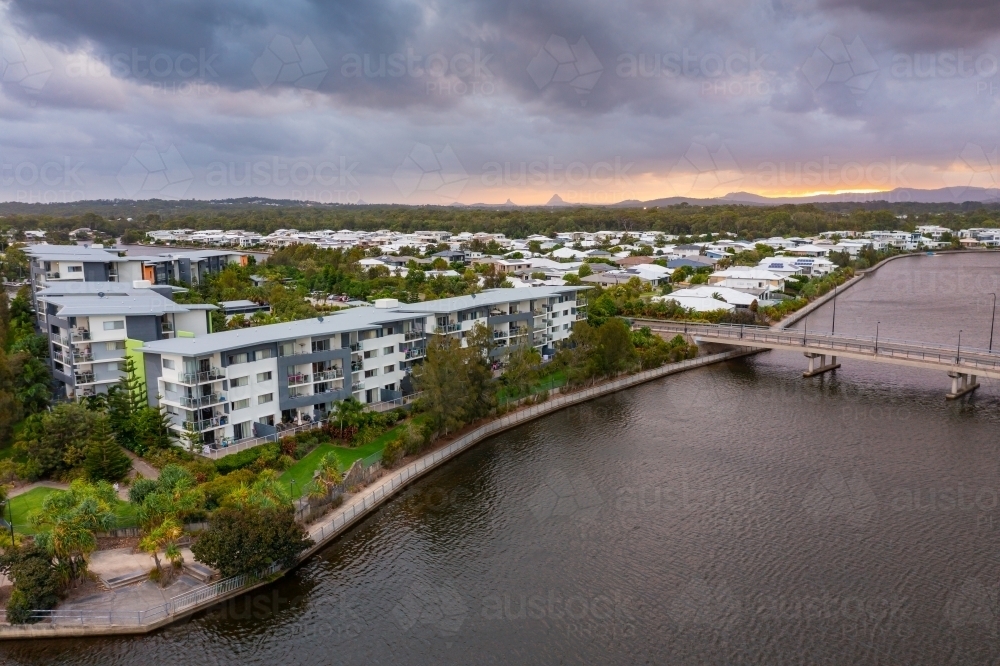 Image of Aerial view of waterfront accommodation and a bridge over a ...