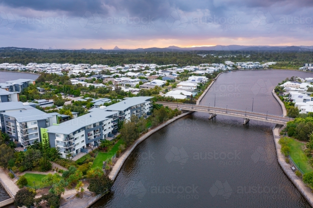 Image of Aerial view of waterfront accommodation and a bridge over a ...