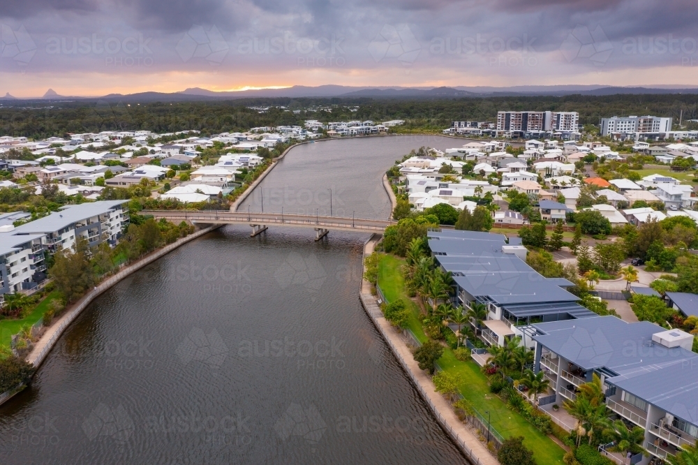 Image of Aerial view of waterfront accommodation and a bridge over a ...