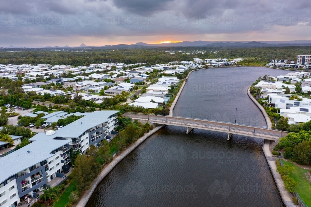 Image of Aerial view of waterfront accommodation and a bridge over a ...