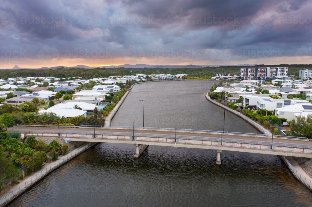 Image of Aerial view of waterfront accommodation and a bridge over a ...