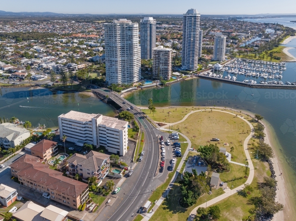 Image of Aerial view of waterfront esplanade crossing a bridge below ...