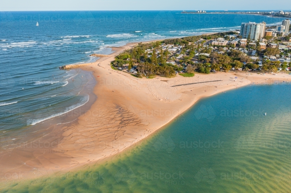 Image of Aerial view of waterfront property alongside a blue coastal ...