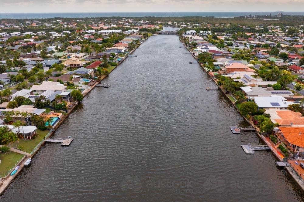 Image of Aerial view of waterfront real estate and small jettys lining ...