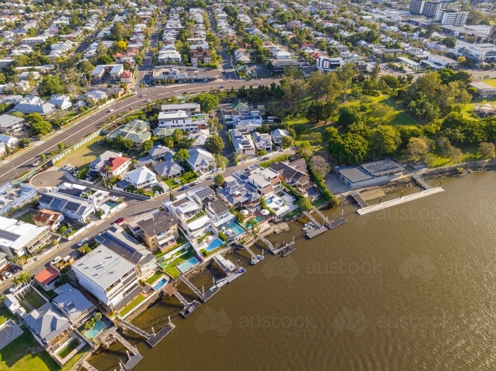 Image of Aerial view of waterfront real estate and their jetties on a ...