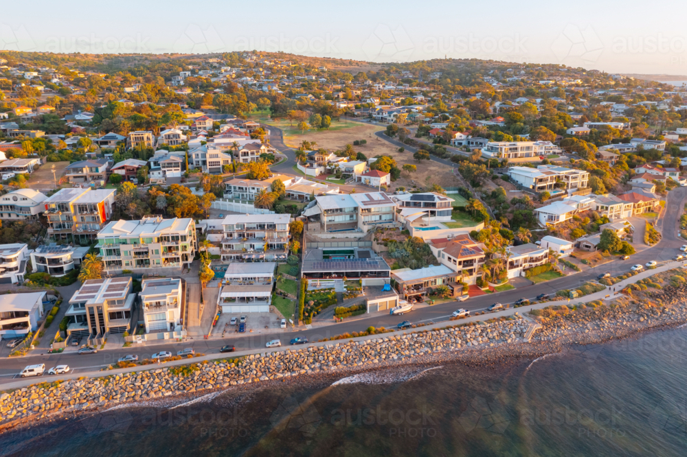 Image of Aerial view of waterfront real estate behind a coastal ...