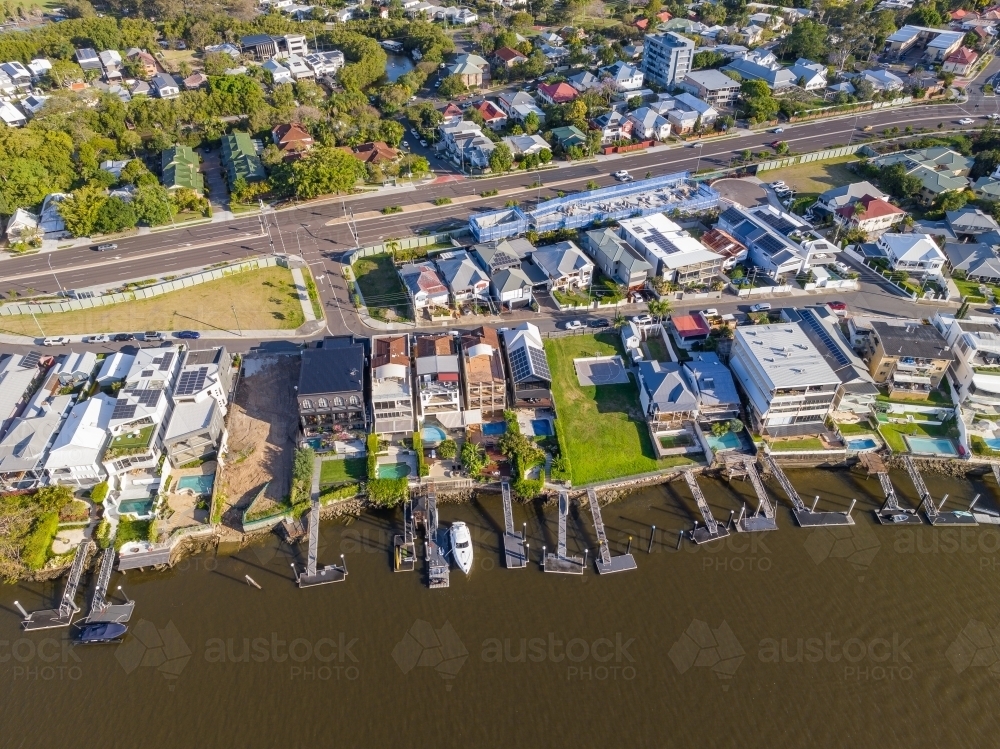 Image of Aerial view of waterfront real estate with jettys on a river ...