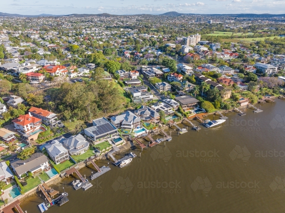 Image of Aerial view of waterfront real estate with jettys on a river ...