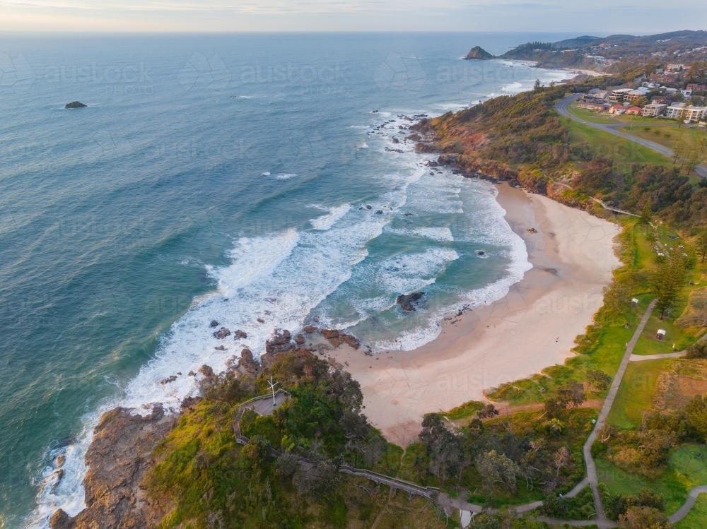 Image of Aerial view of waves breaking on the beach of a coastal bay ...