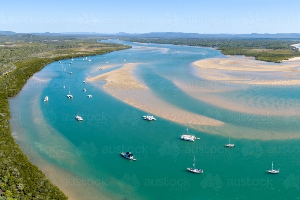 Image of Aerial view of yachts anchored in an estuary at the Town of ...
