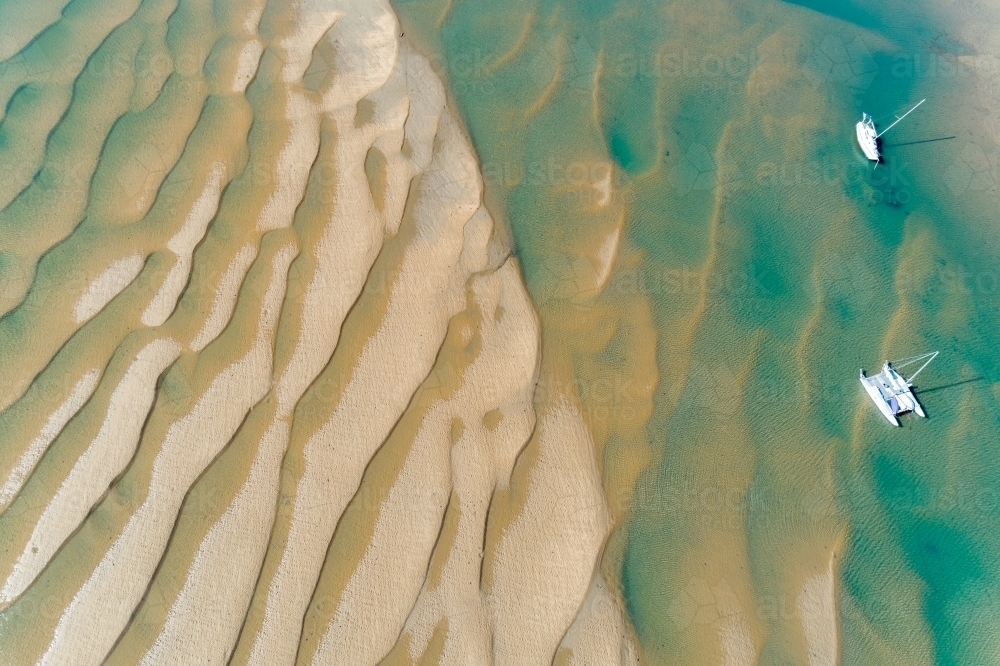 Image of Aerial view of yachts anchored in shallow estuary, Seventeen ...