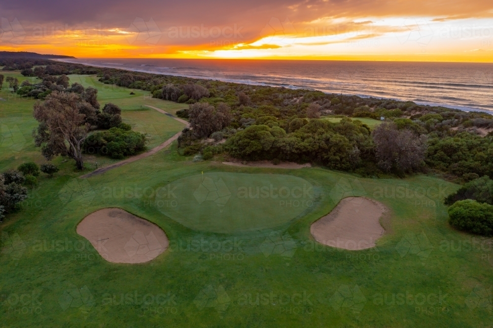 Image of Aerial view over a coastal golf course with a colourful ...