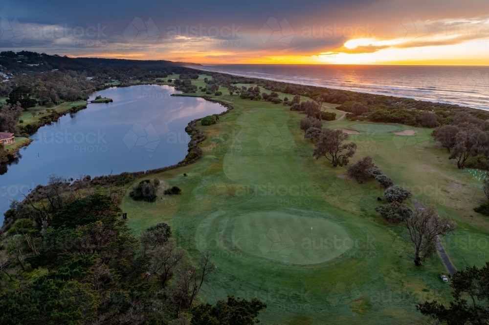 Image of Aerial view over a coastal golf course with a colourful ...