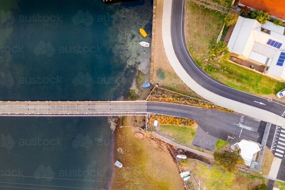 Image of Aerial view over a fork in the road going over a bridge ...