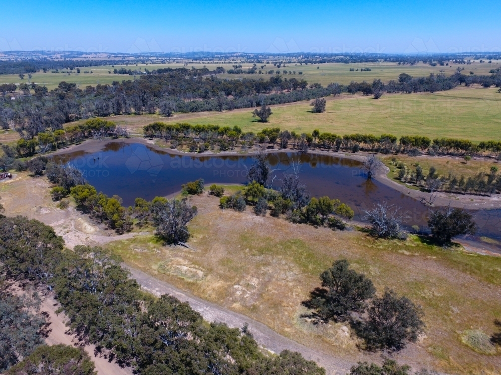 Image of Aerial view over landscape with waterhole in river - Austockphoto