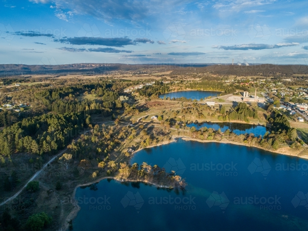 Image of Aerial view over old quarry now a lake and Portland Cement ...