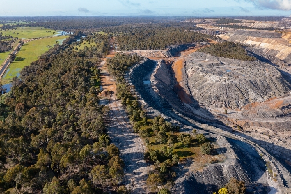 Image of aerial view showing farmland, natural bush, and open cut mine ...