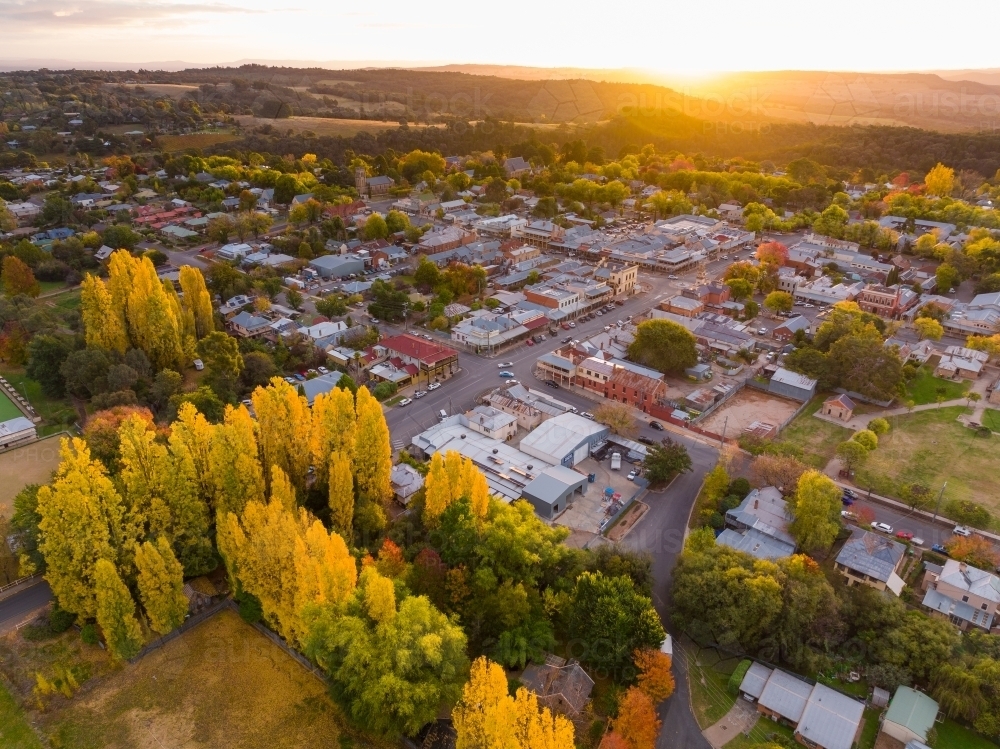 Image of Aerila view over a country town in Autumn with the Sun setting ...