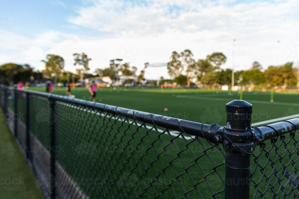 Image of afternoon football practice in the suburbs - Austockphoto