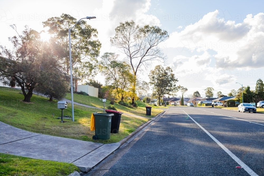 Image of Afternoon light over street in suburban residential area with ...