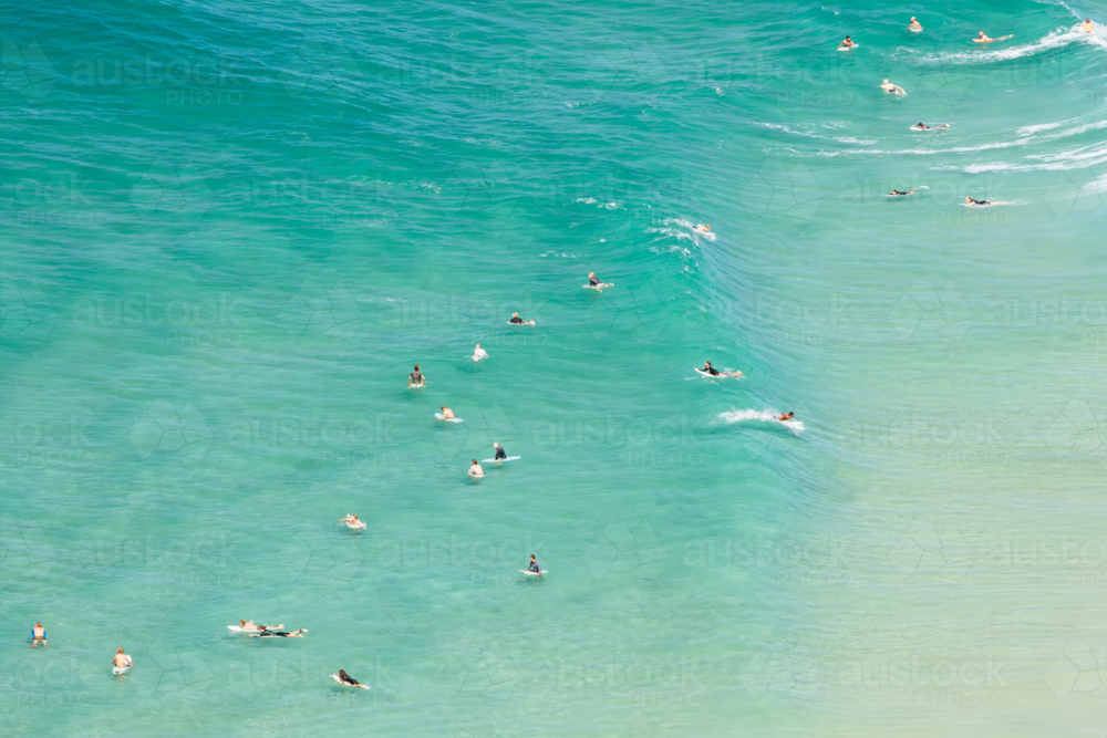 Image of An aerial view of surfers at Tallows Beach in Byron Bay, New ...
