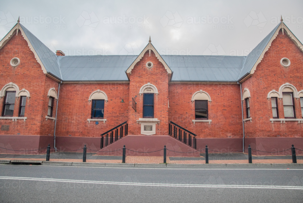 Image of An historic red brick building in a country town - Austockphoto