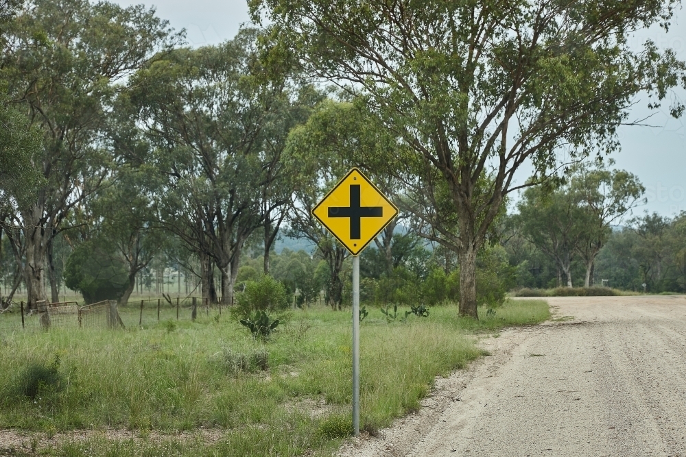 Image of An intersection signage on gravel country road by paddock ...