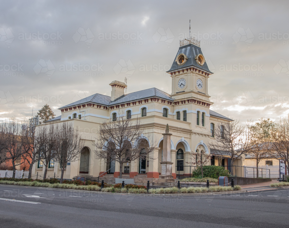 Image of An old town Post Office building with a clock tower under grey ...