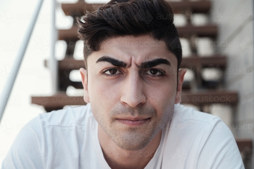 Image of Angry multicultural young adult man - Austockphoto