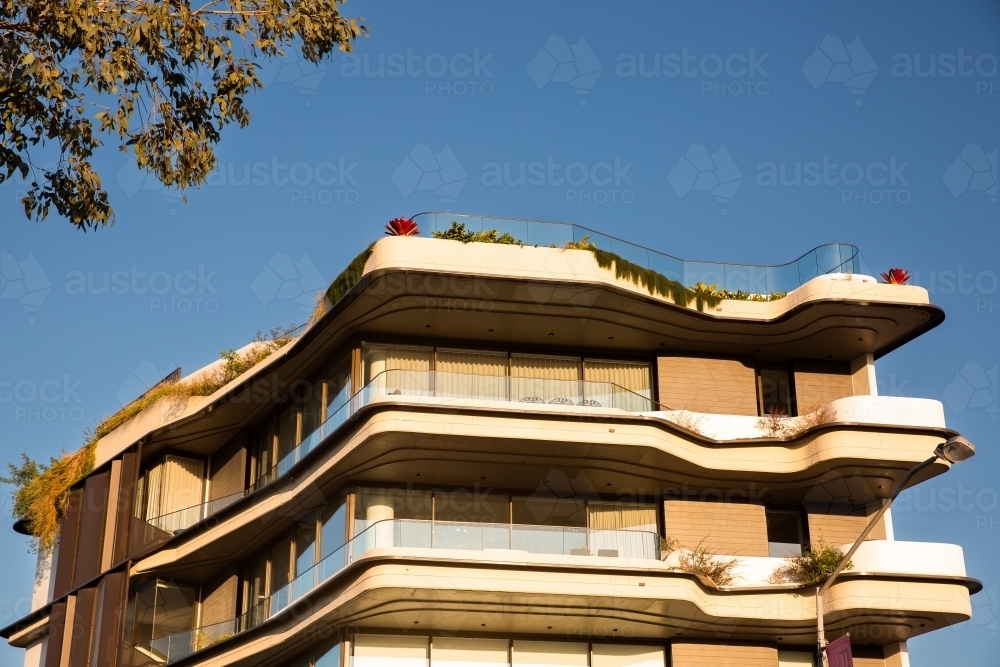 Image of apartment building in golden afternoon light on a clear day ...