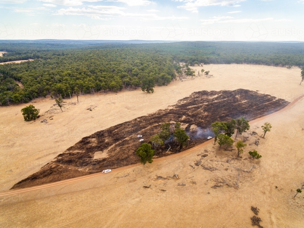 Image of Area of blackened burnt ground in farmland - Austockphoto