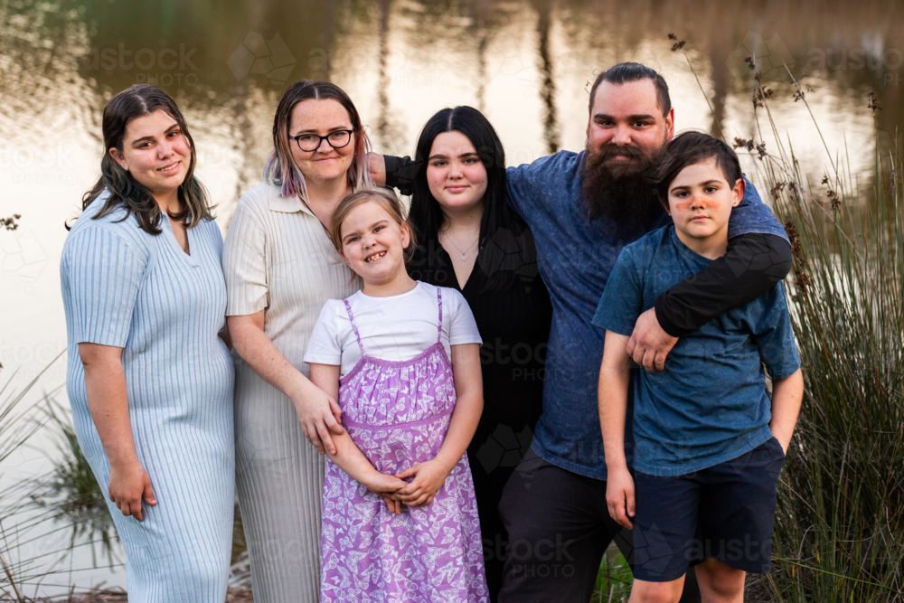 Image of Aussie Aboriginal Worimi family portrait by dam at dusk ...