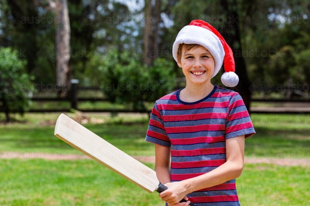 Image of Aussie boy ready to play backyard cricket in front yard at ...