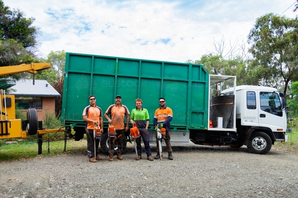 Image of Aussie workmen standing in front of their truck ready to ...