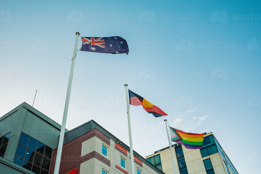 Image of Australian, Aboriginal and LQBTQ+ pride flags flying outside ...
